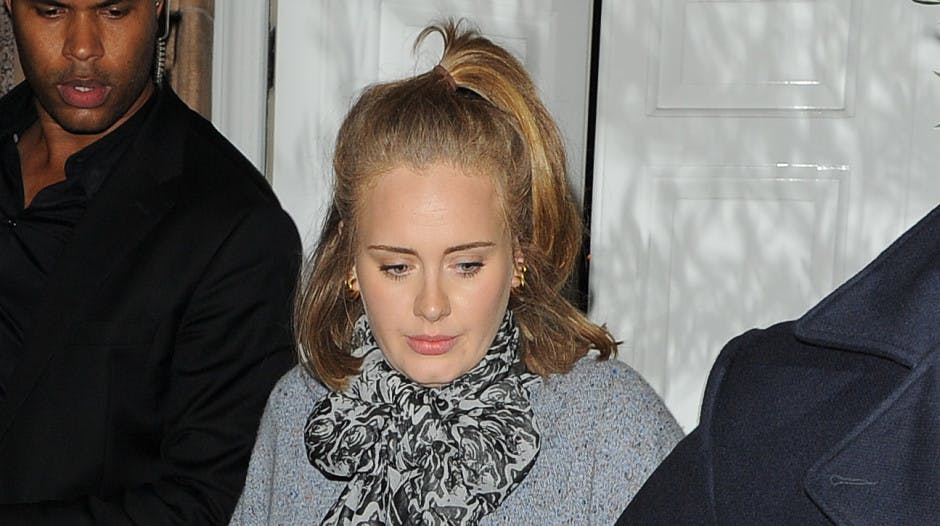 Adele has called in close pal Robbie Williams to cheer her up after her ...