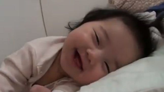 VIDEO: Cute baby tries desperately to stay awake to see her mum, but ...