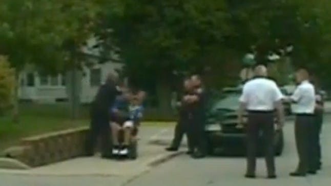 Outrage Over Footage Of Policeman Pushing Over Man In Wheelchair Closer