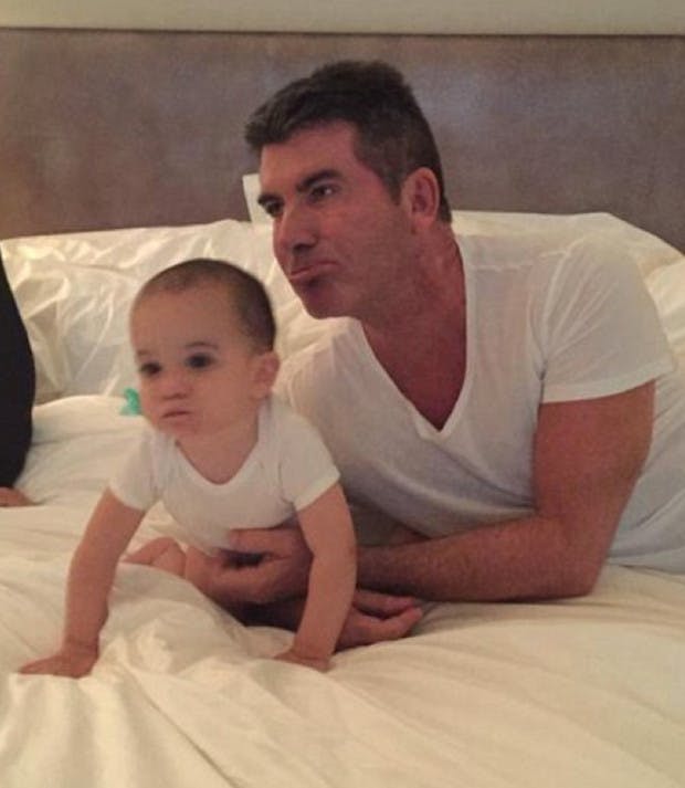 Simon Cowell Holding Baby
